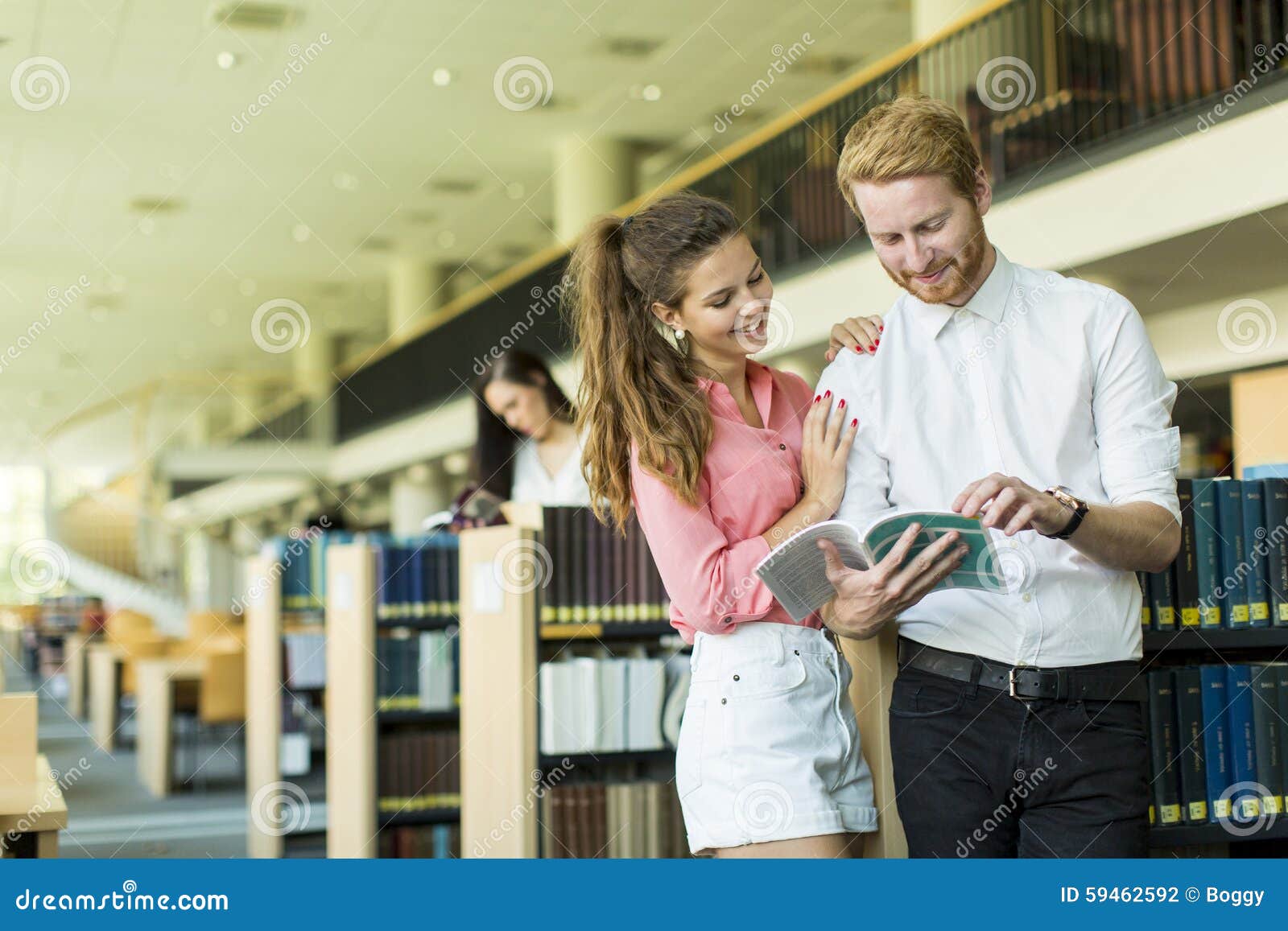 Young Couple in the Library Stock Photo - Image of women, book: 59462592