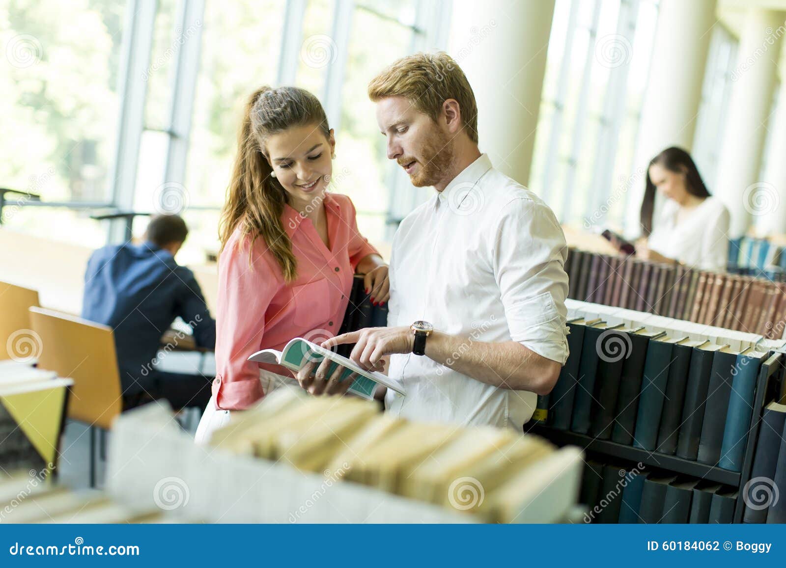 Young Couple in the Library Stock Photo - Image of female, indoors ...