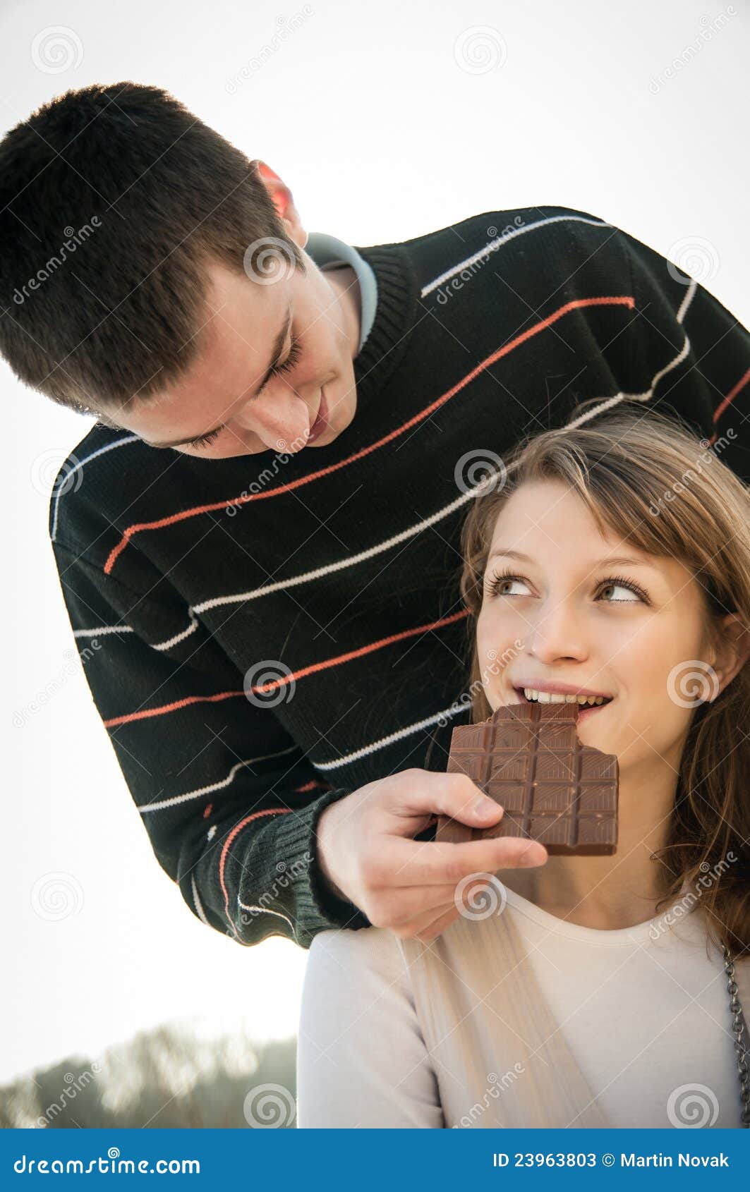 Young Couple in Locve Eating Chocolate Stock Image - Image of backlight ...