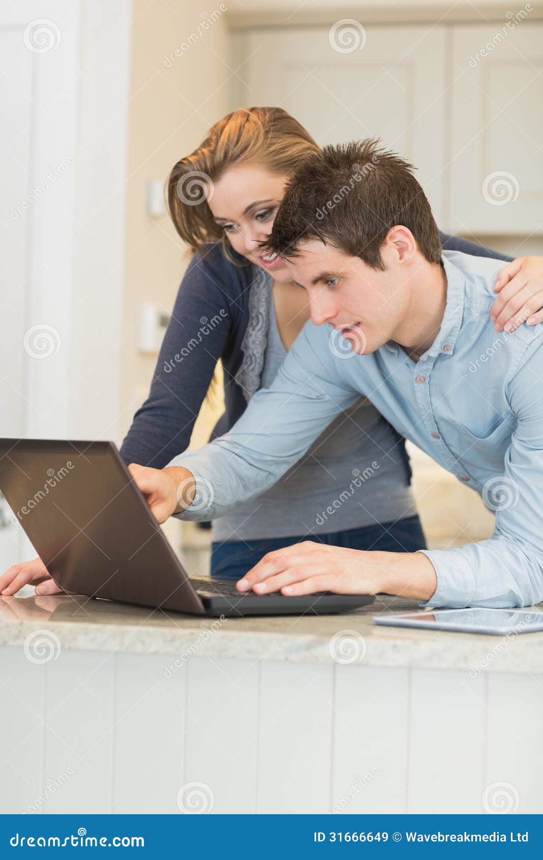 Young Couple Looking at Laptop Stock Image - Image of girlfriend ...