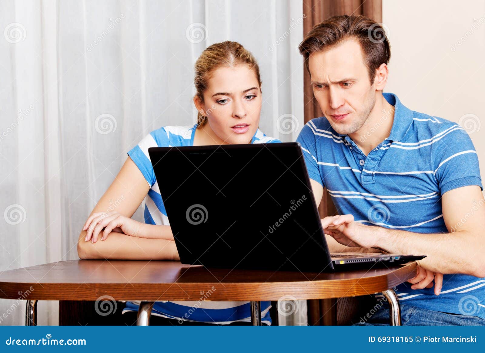 Young Couple Looking for Something on Laptop Stock Image - Image of ...
