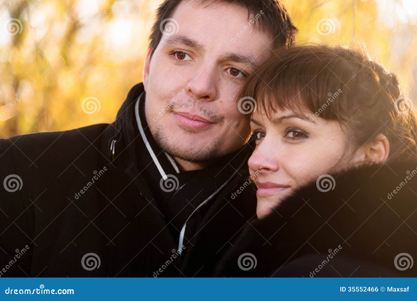 Young Couple Looks Forward on the Yellow Leaves Stock Photo - Image of ...
