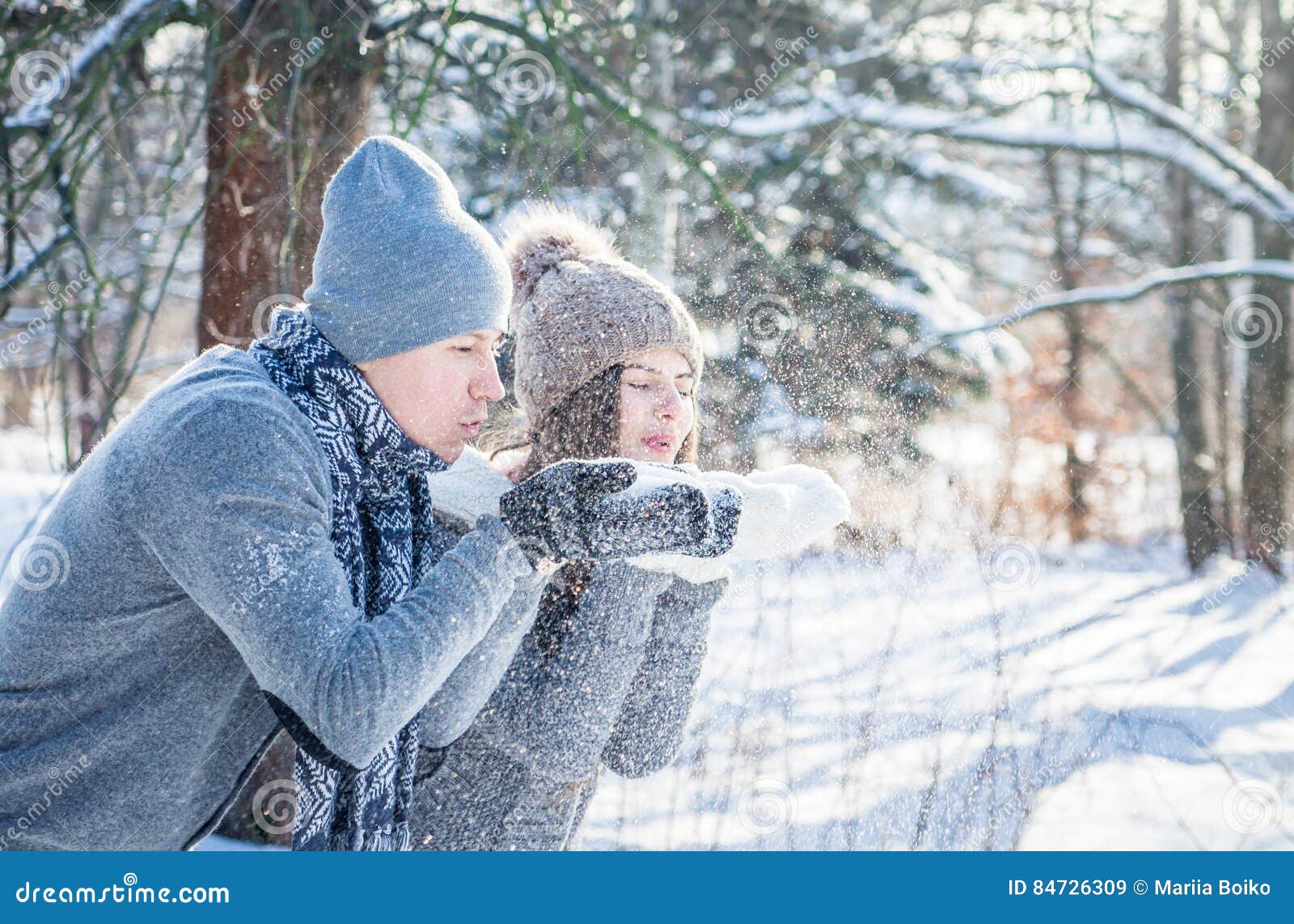 Young Couple in Love Blows Snow Stock Image - Image of laugh, love ...