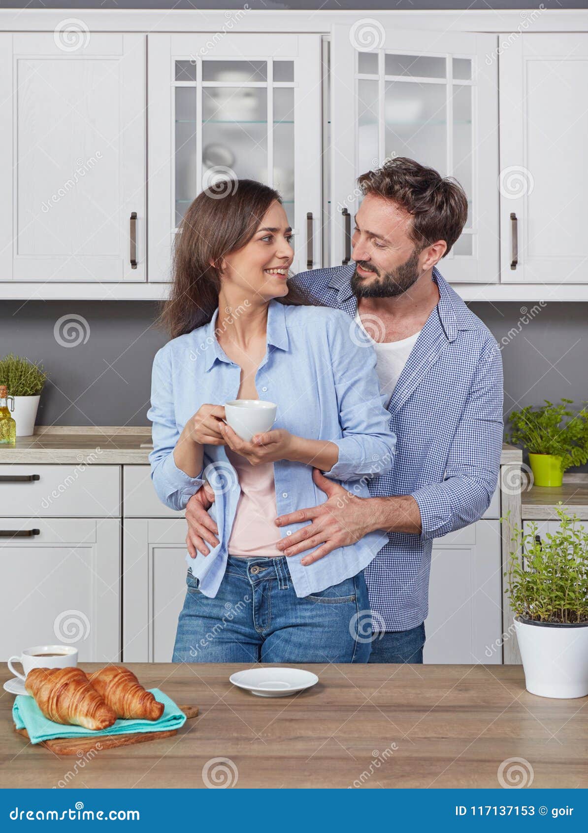 Couple in the kitchen stock image. Image of domestic - 117137153