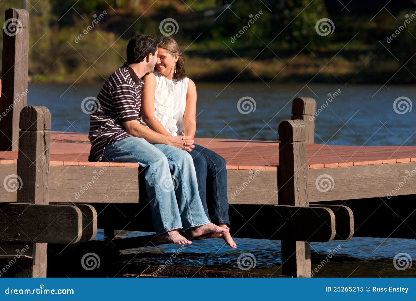 Young Couple in Love Sit Barefoot on Dock Stock Image - Image of autumn ...