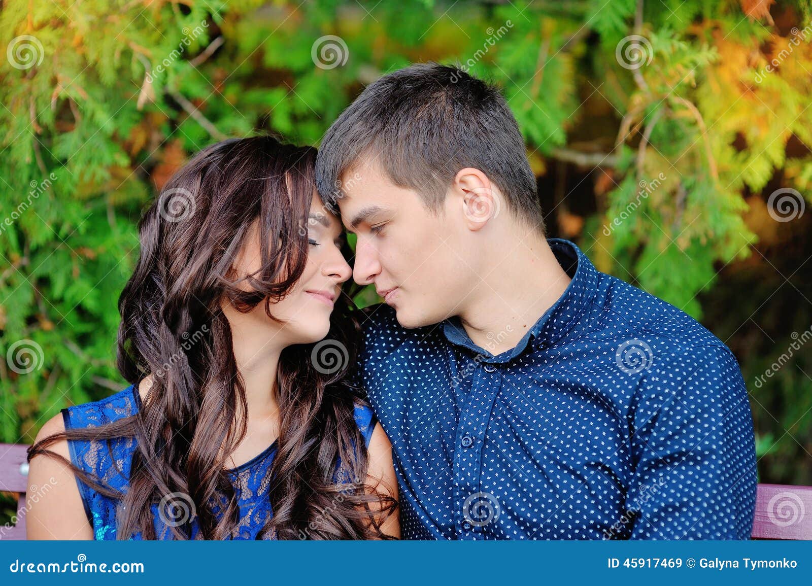 Young Couple in Love Sitting on the Bench, a Romantic Moment Stock ...