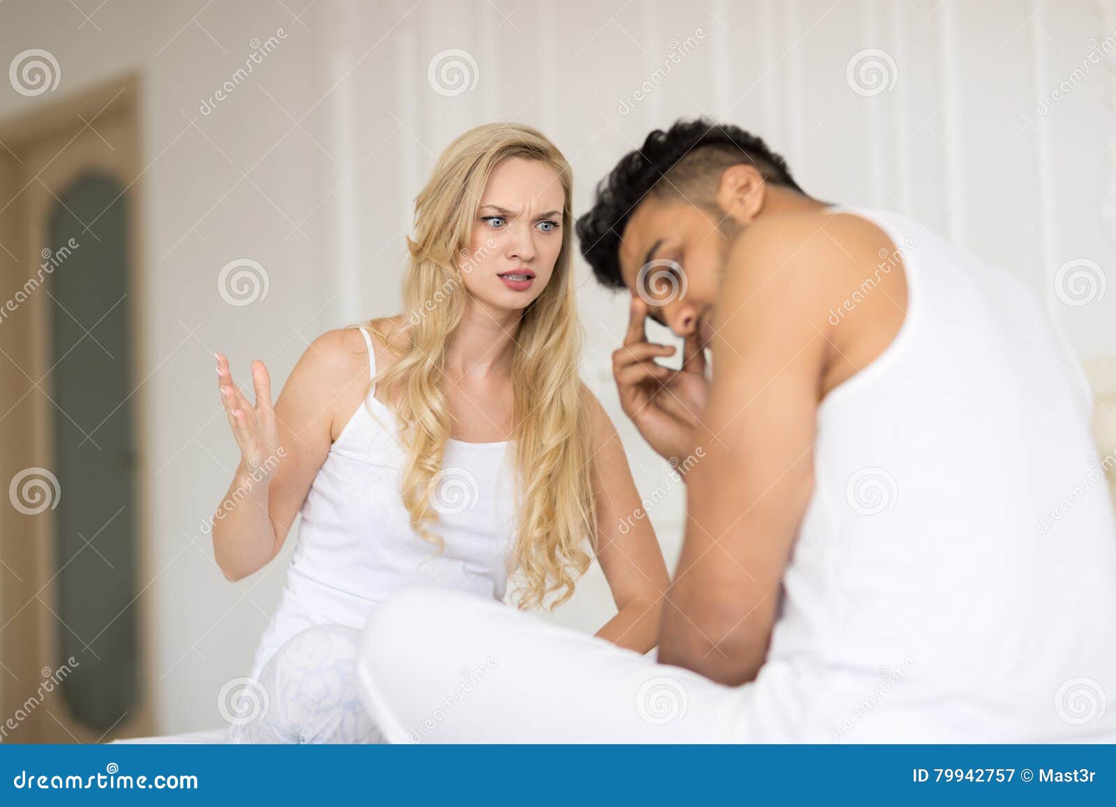 Young Couple Lying In Bed Having Conflict Relationships Problem Sad