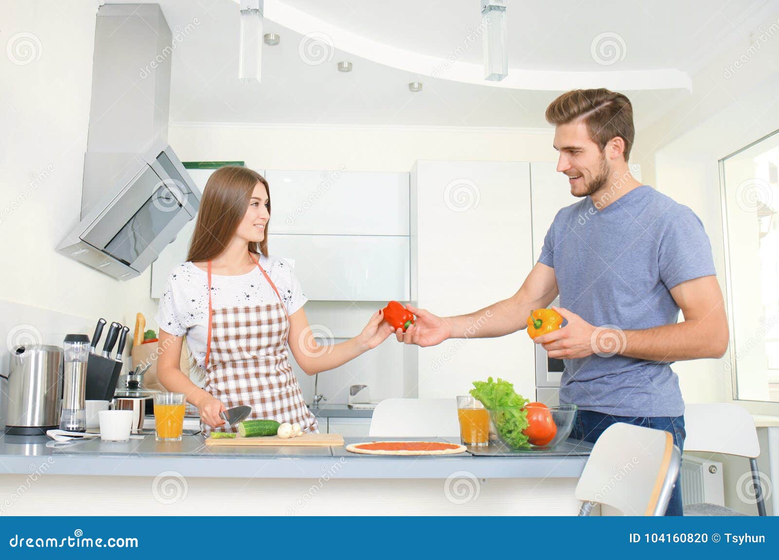 Young Couple Making Pizza in Kitchen Together. Stock Photo - Image of ...
