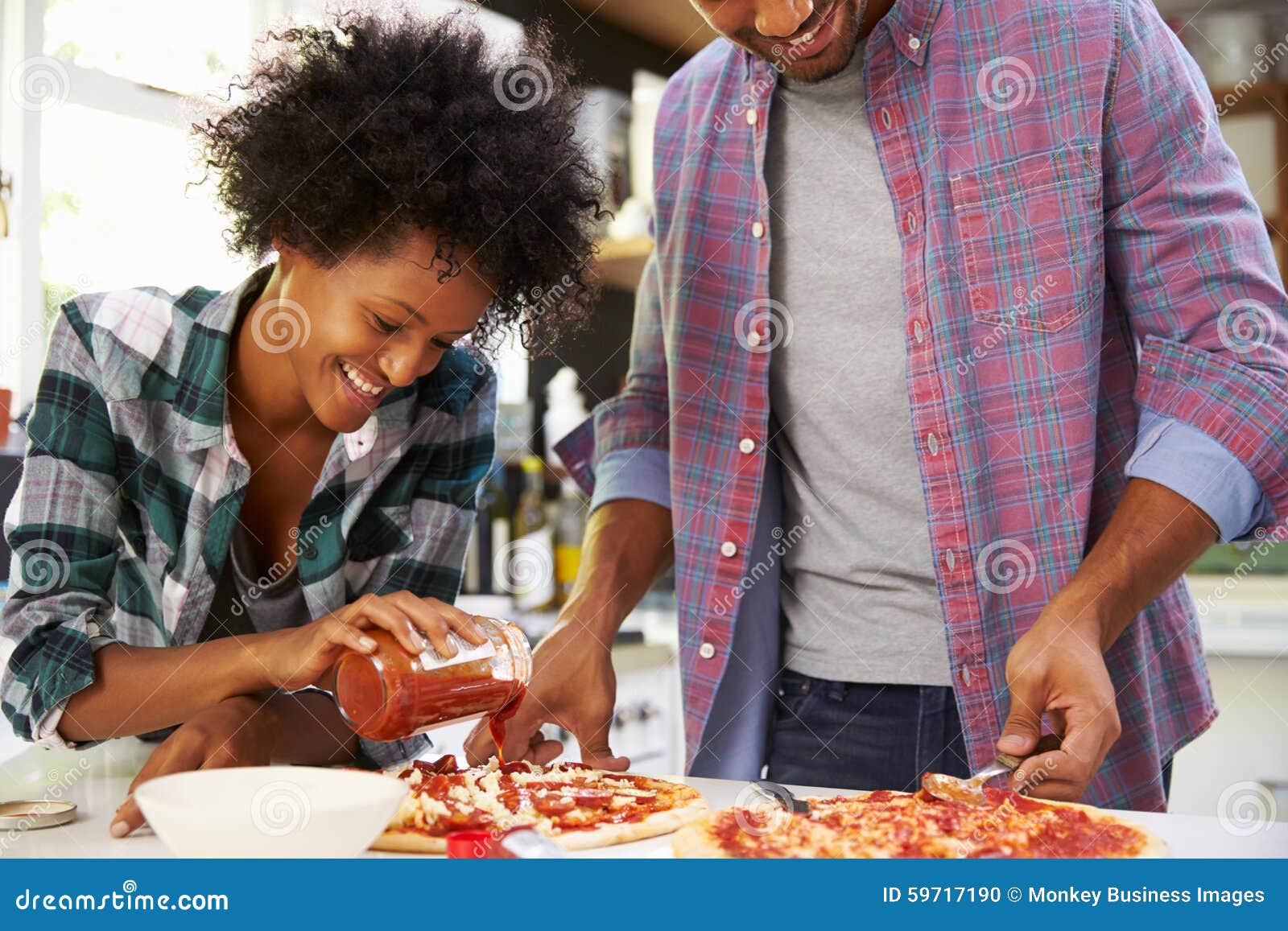 Young Couple Making Pizza in Kitchen Together Stock Photo - Image of ...