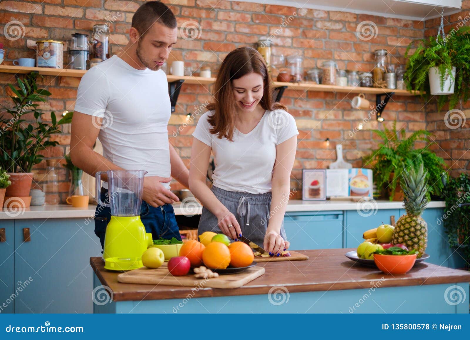 Young Couple Making Smoothie in Kitchen Stock Photo - Image of fresh ...
