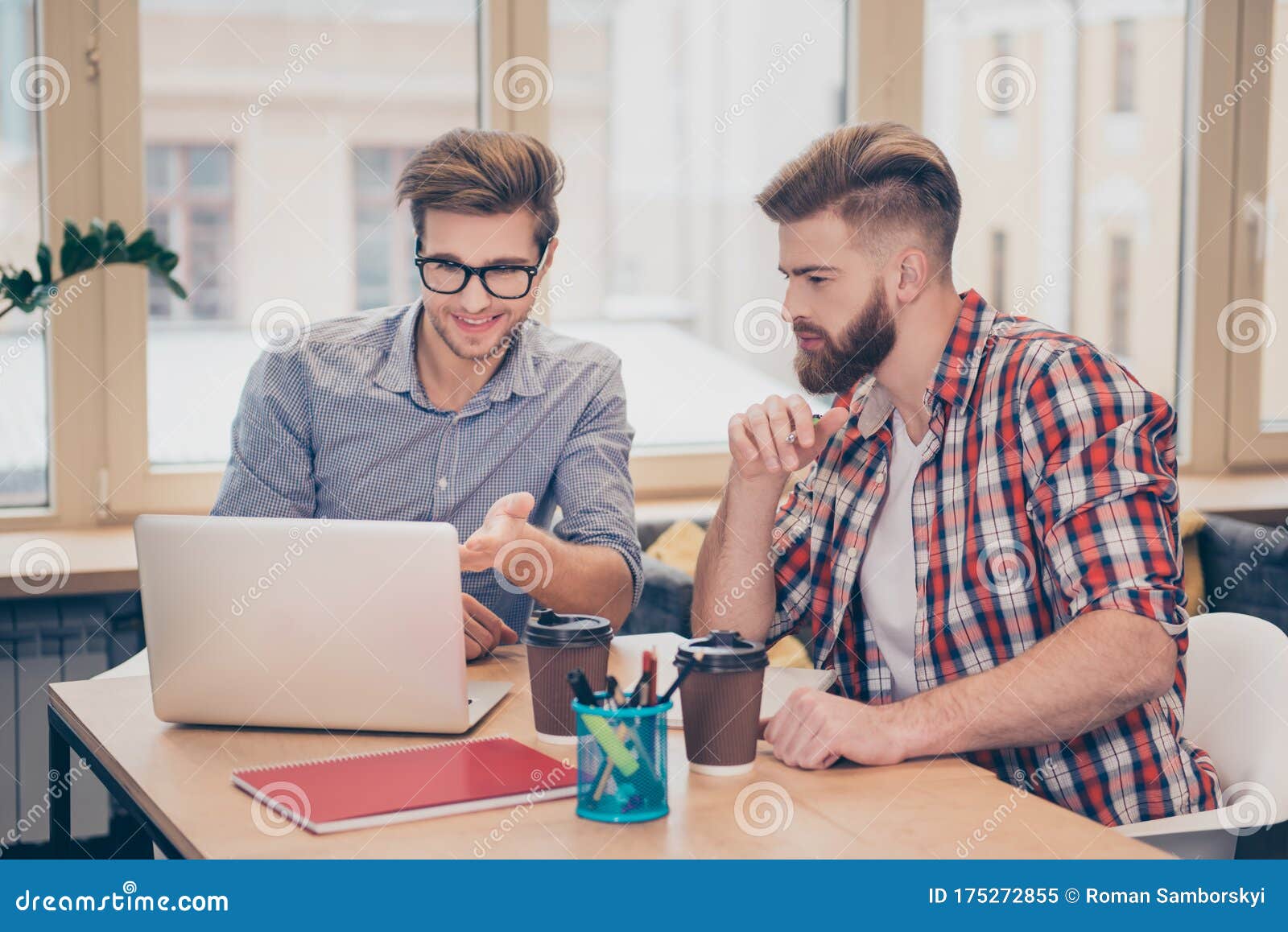 Young Couple of Managers Working Together on Laptop in Office Stock ...