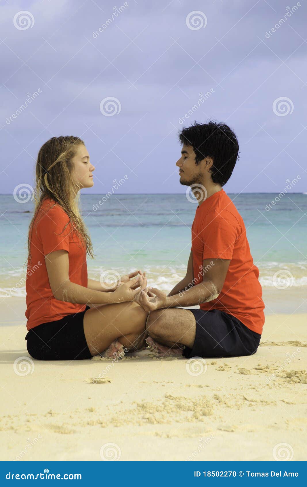 Young couple meditating stock photo. Image of hawaiian - 18502270