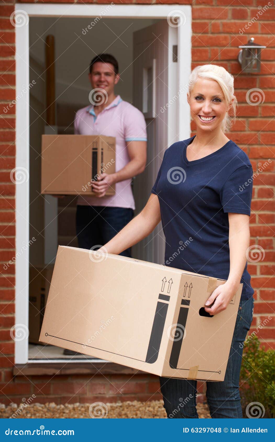 Young Couple Moving into New Home Together Stock Photo - Image of ...