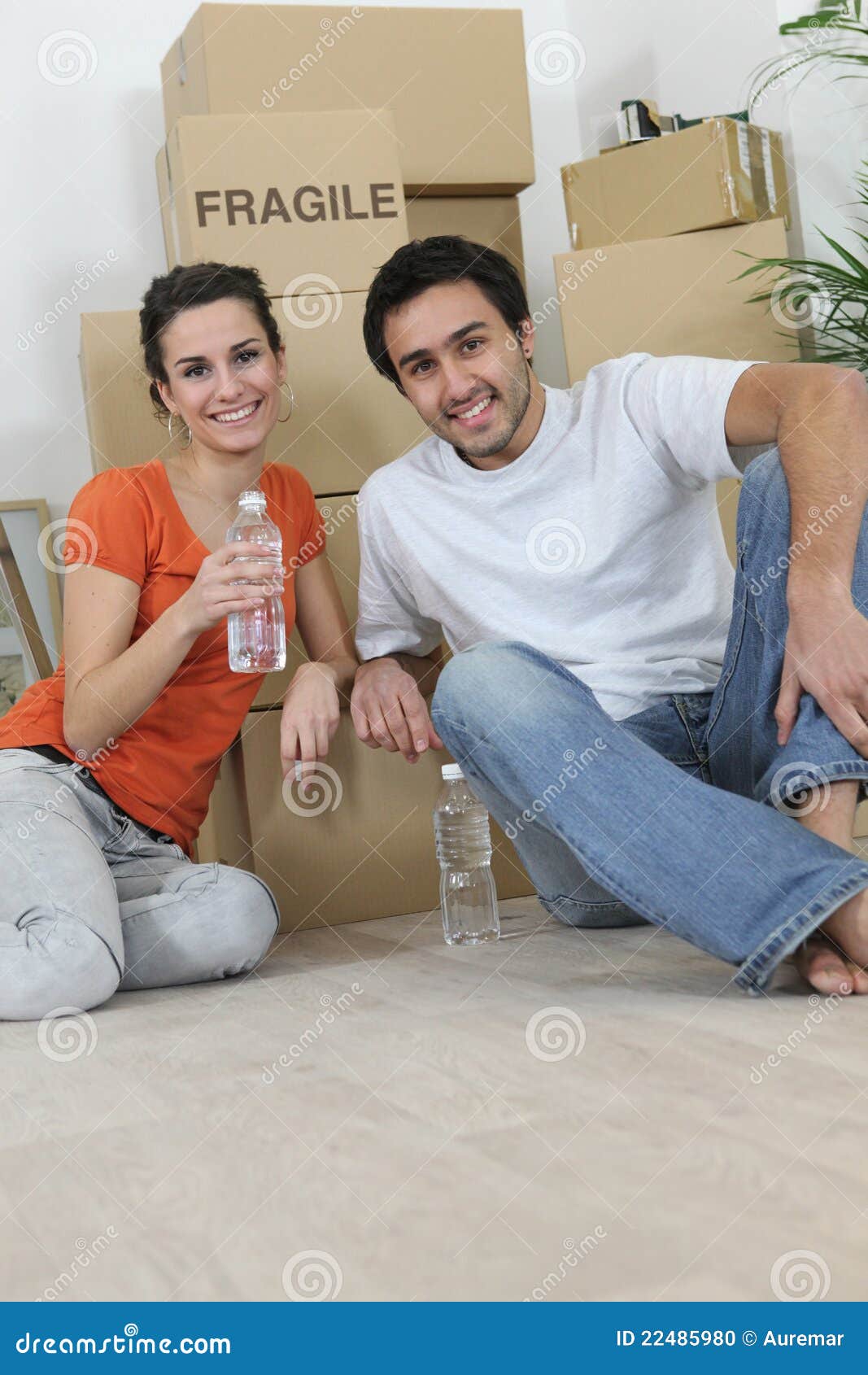 Young Couple Moving in Together Stock Photo - Image of room, owner ...