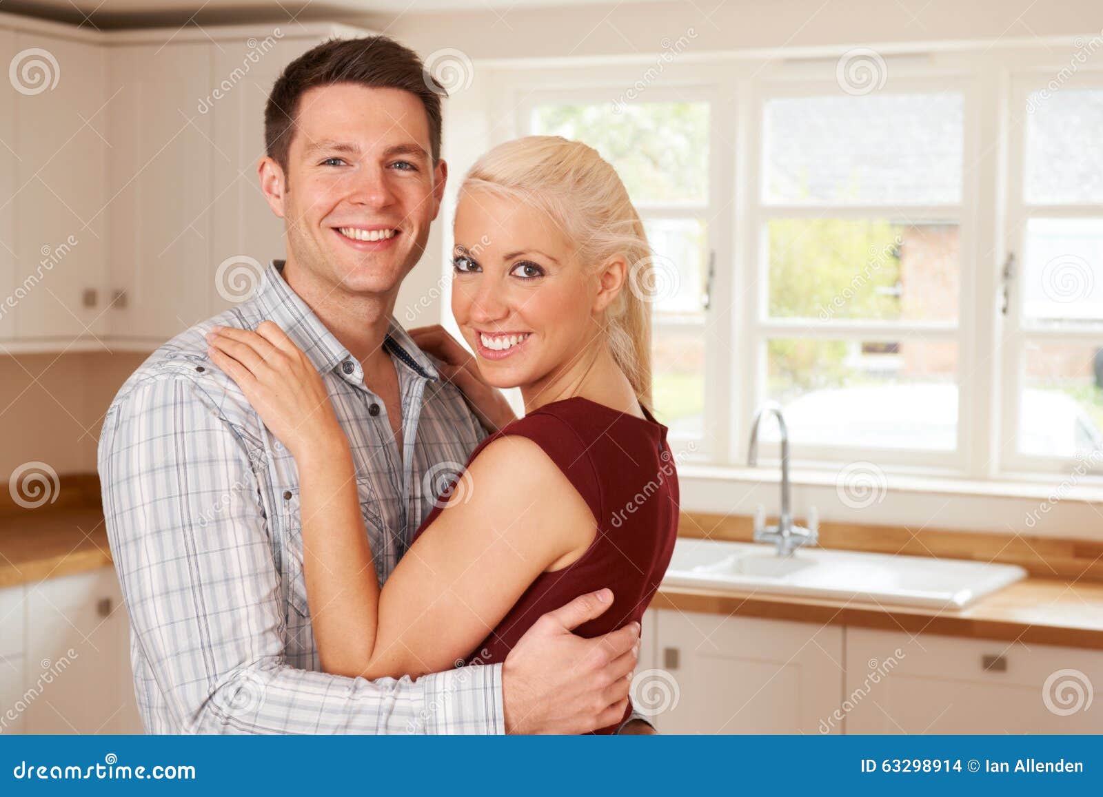 Young Couple in New Home Together Stock Photo - Image of twenties, face ...