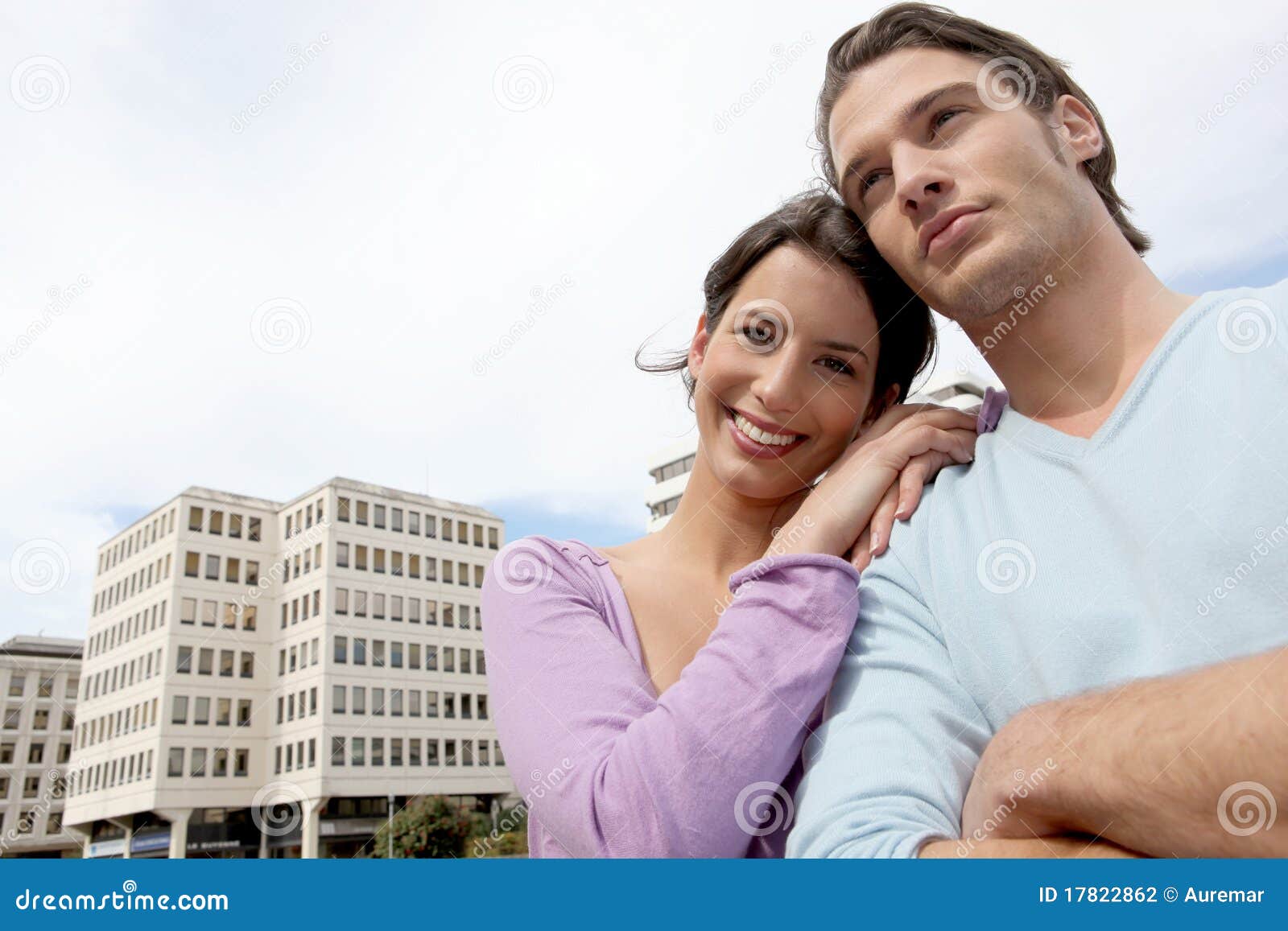 Young Couple Next To Buildings Stock Photo - Image of standing ...