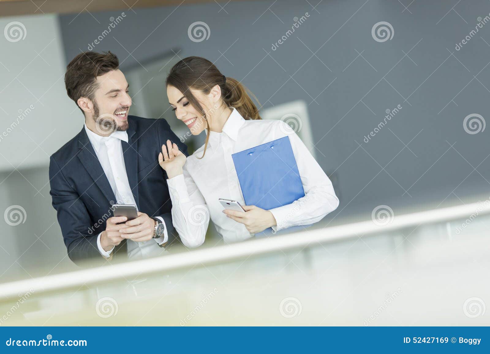 Young couple in the office stock image. Image of young - 52427169