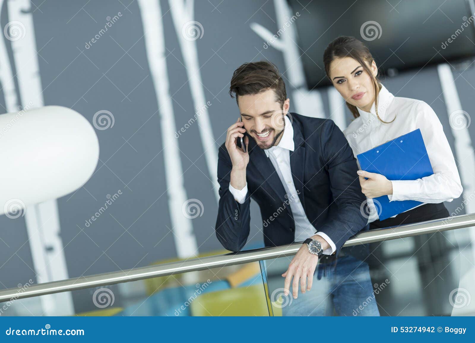 Young couple in the office stock photo. Image of mobile - 53274942