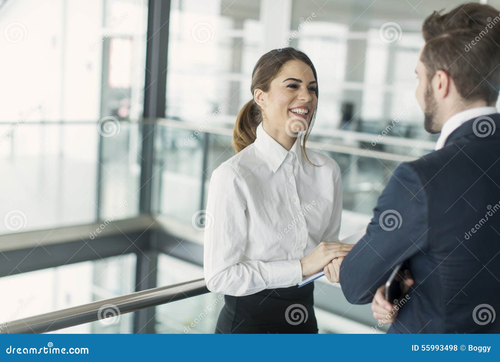 Young couple in the office stock photo. Image of consultant - 55993498