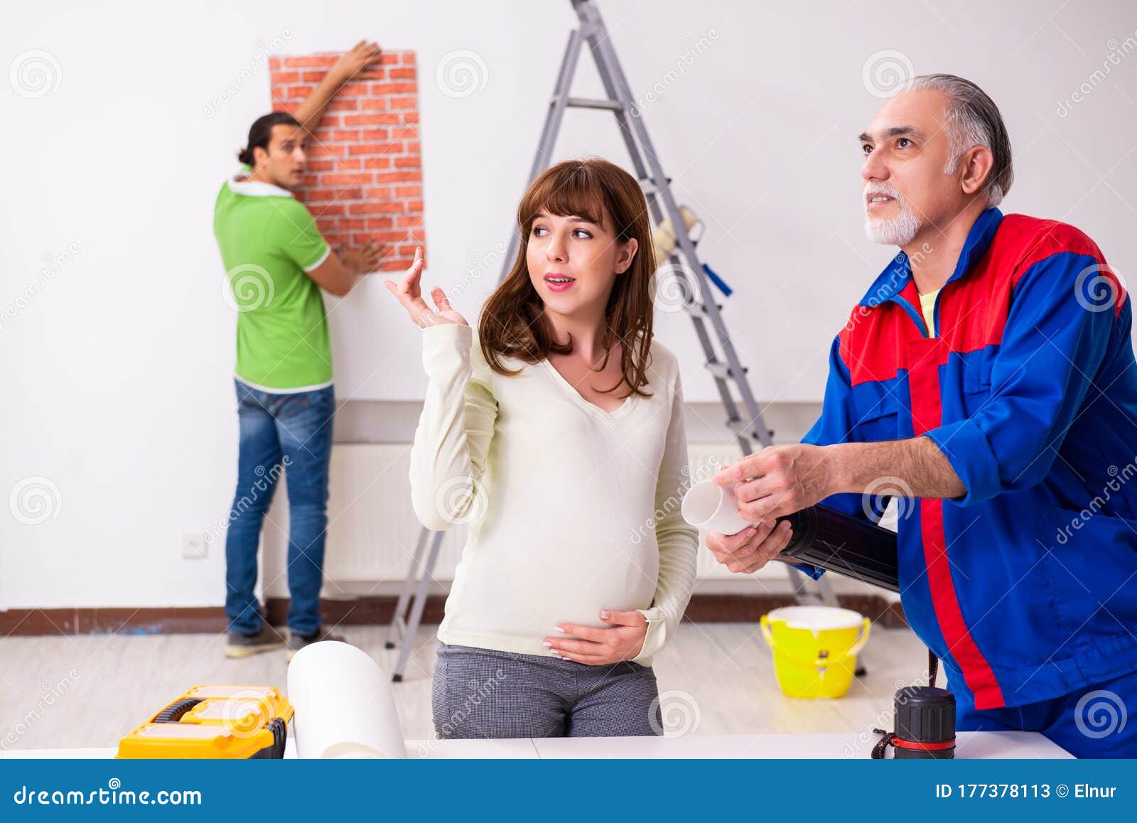 Young Couple and Old Contractor in Home Renovation Concept Stock Image ...