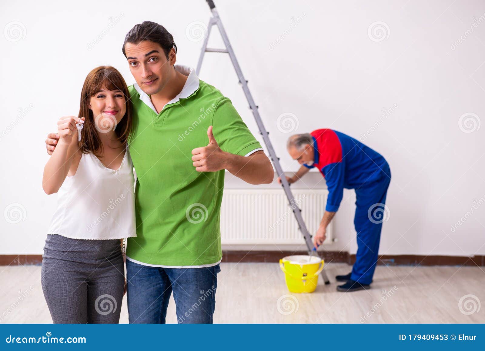 Young Couple and Old Contractor in Home Renovation Concept Stock Image ...