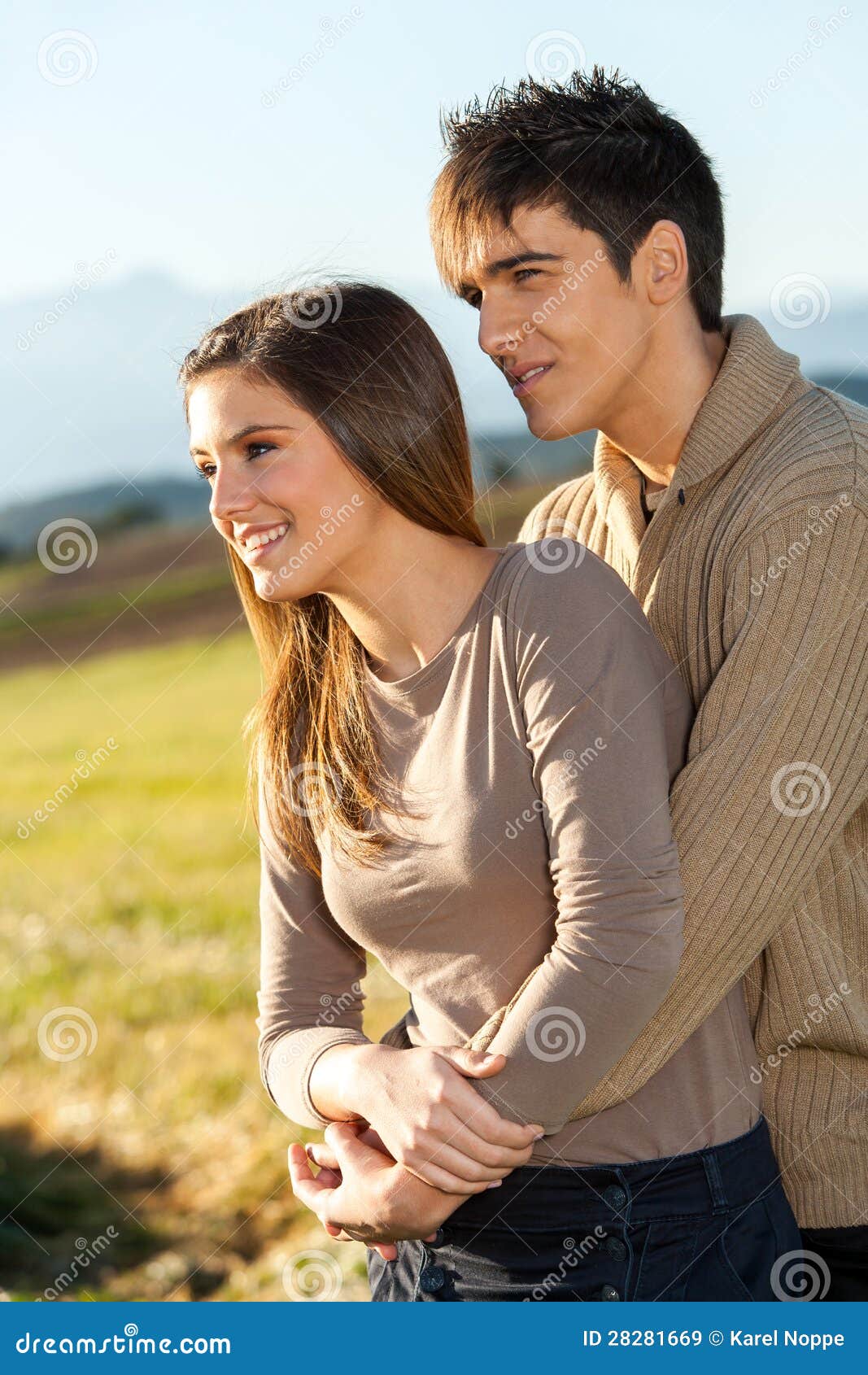 Young Couple Outdoors in Rural Field. Stock Image - Image of female ...