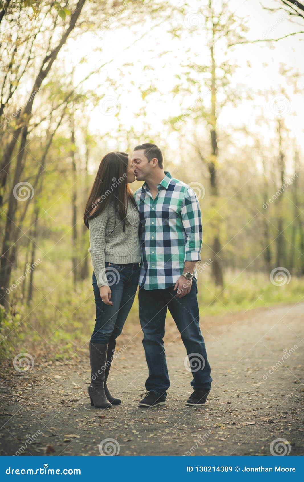 Couple Holding Hands Kissing In The Park Stock Image Image Of Showing