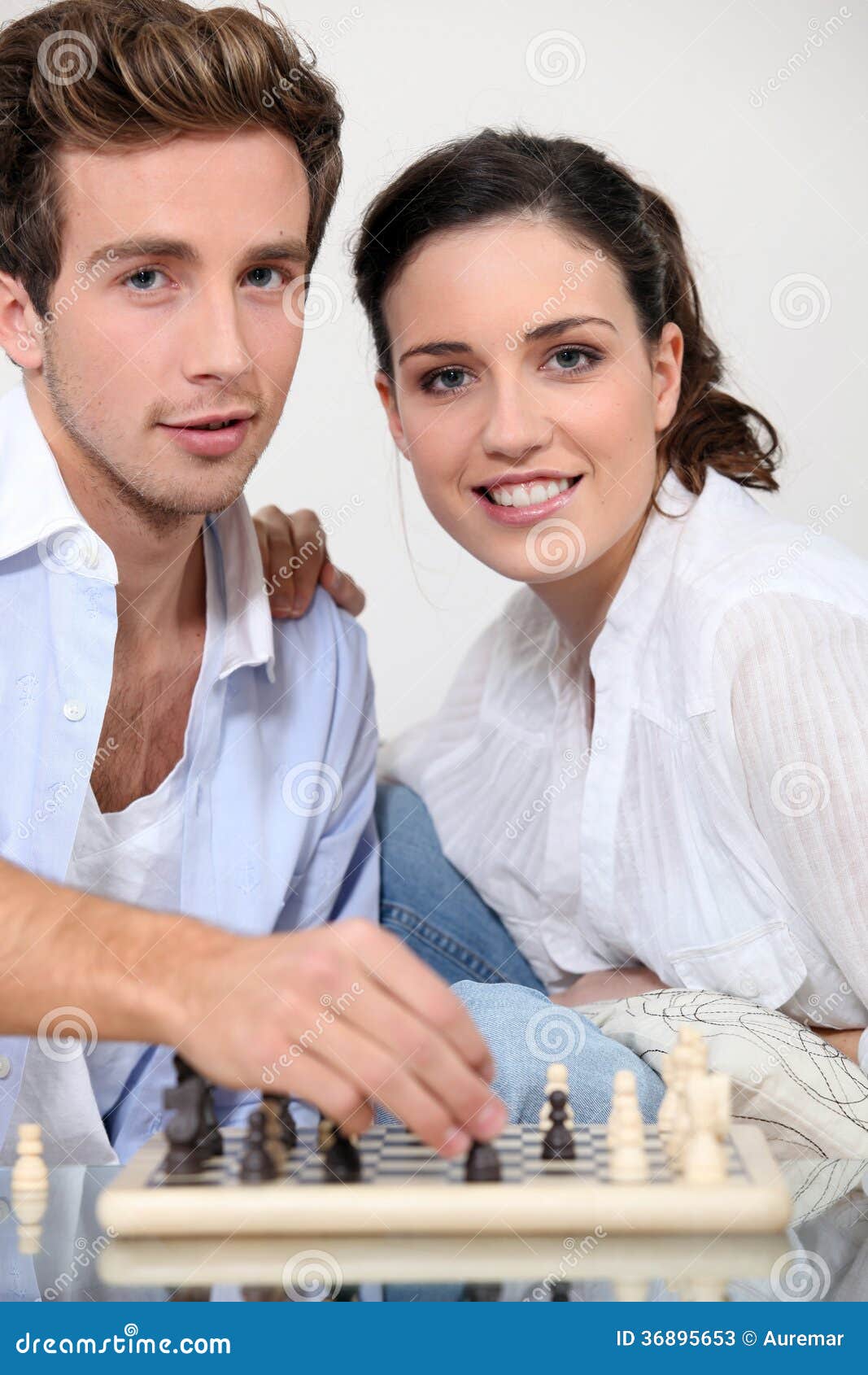 Young couple playing chess stock image. Image of love - 36895653