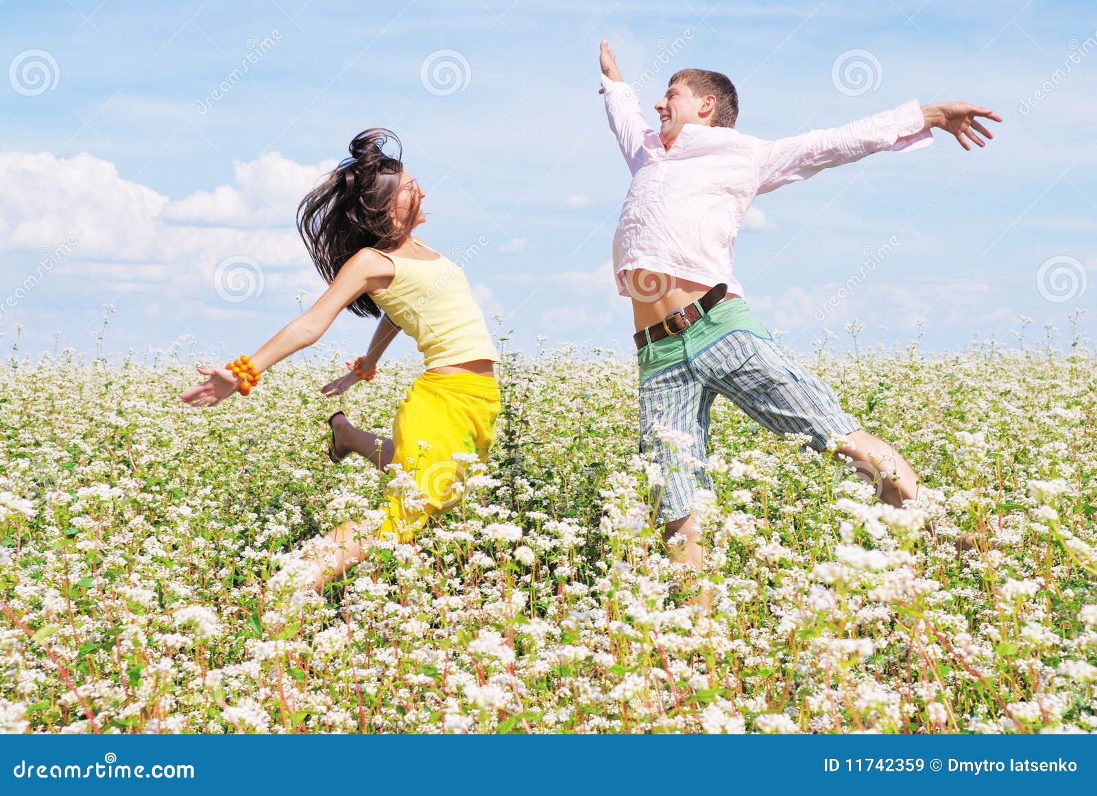Young Couple Playing on Field of Flowers Stock Image - Image of field ...