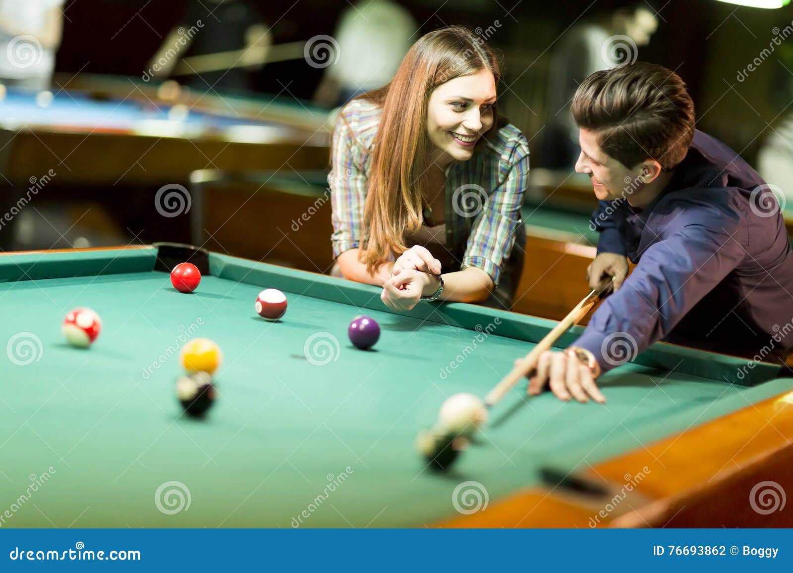 Young couple playing pool stock photo. Image of couple - 76693862