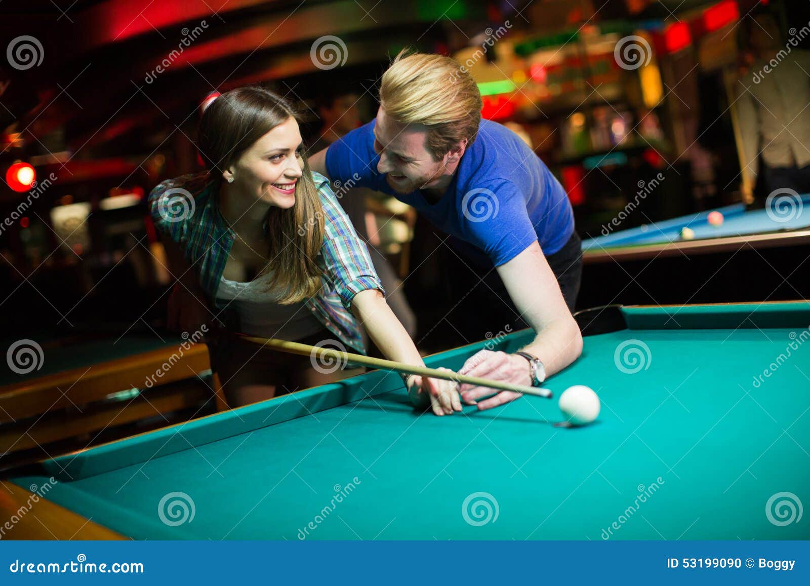 Young couple playing pool stock photo. Image of activity - 53199090