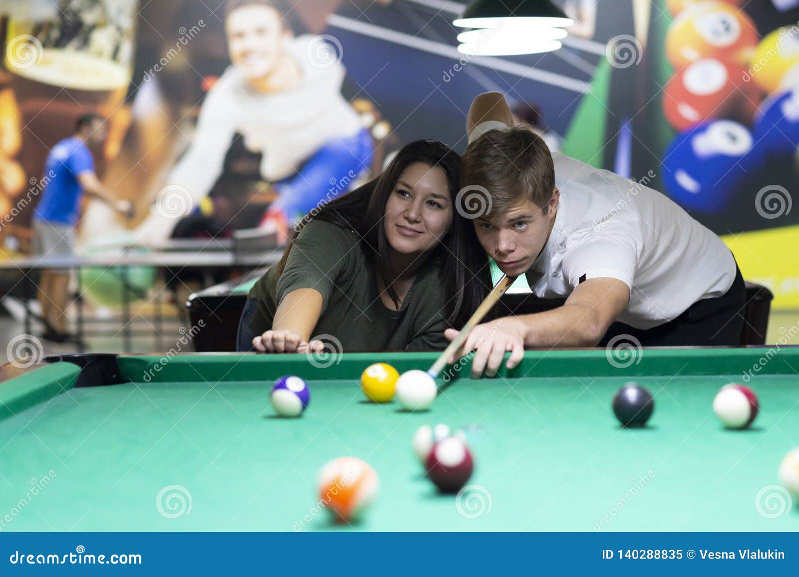 Young Couple Playing Snooker Together in Bar Stock Image - Image of ...