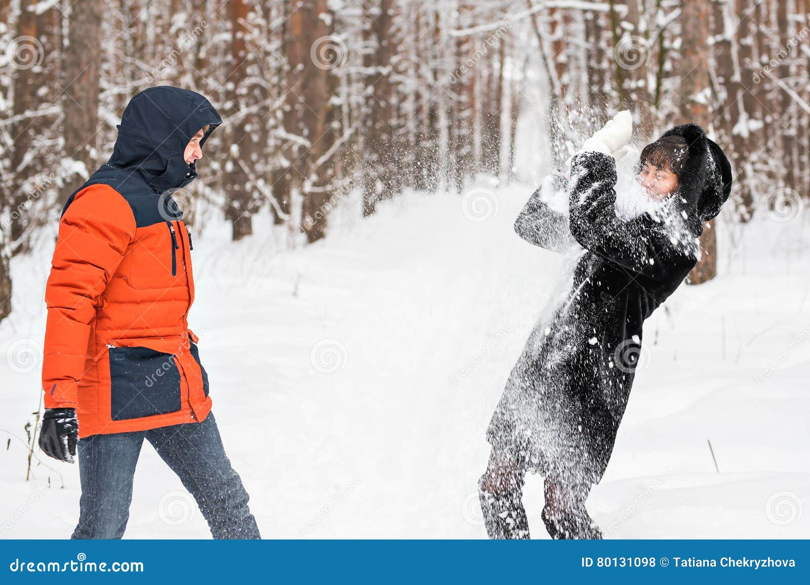 Young Couple Playing in Snow, Having Snowball Fight Stock Photo - Image ...