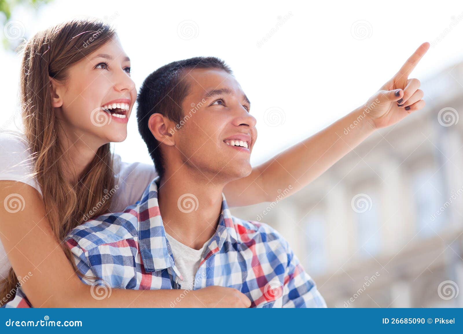 Young couple pointing stock photo. Image of smile, teens - 26685090