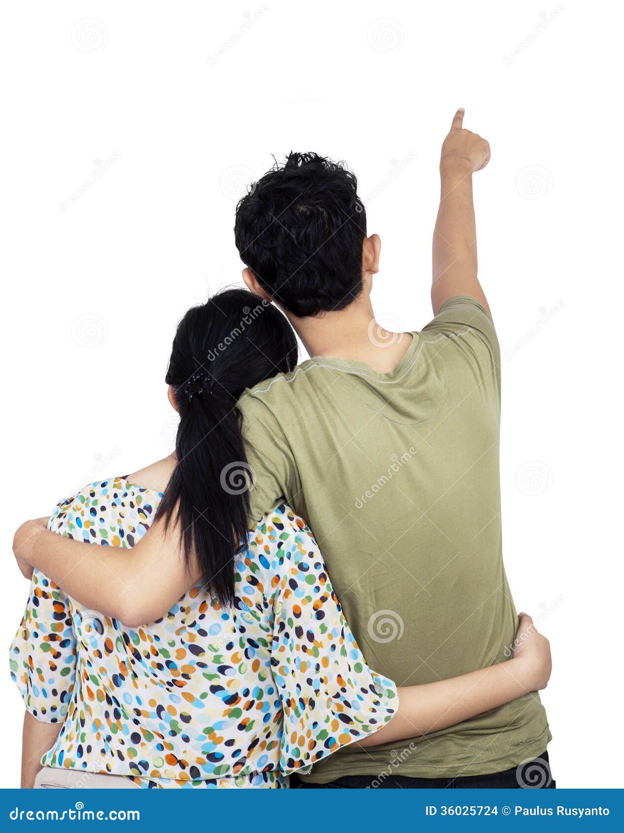 Young Couple Pointing at Wall Stock Photo - Image of girl, isolated ...