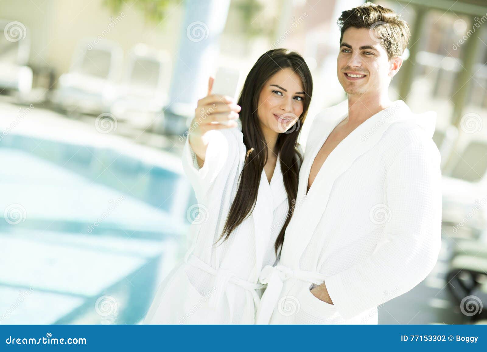 Young couple by the pool stock photo. Image of pool, together - 77153302