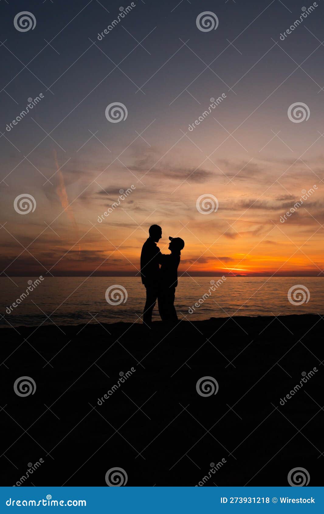 Young Couple, Posing Backlit in a Sunset on the Beach Stock Photo ...