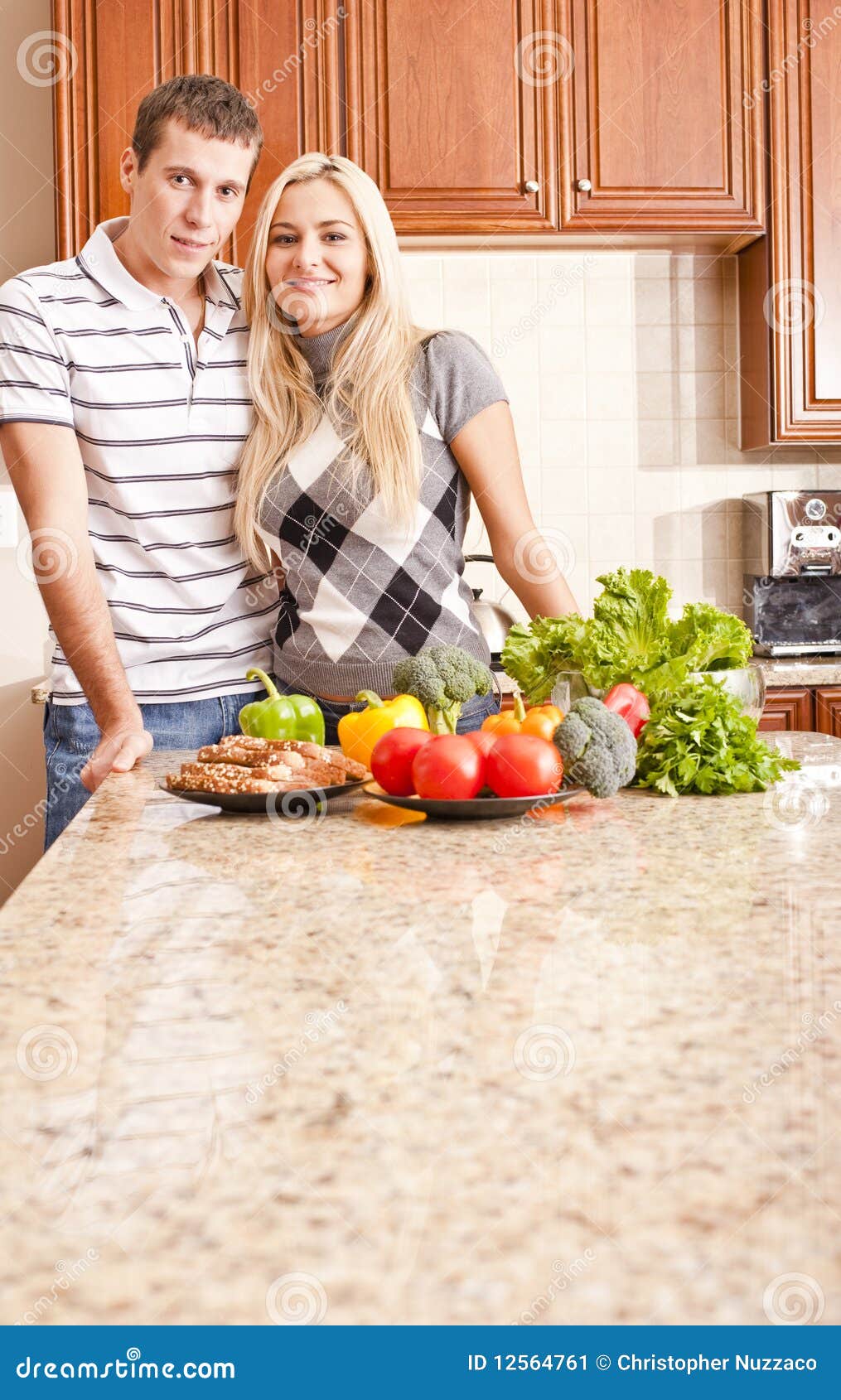 Young Couple Posing in Kitchen Stock Image - Image of camera, counter ...