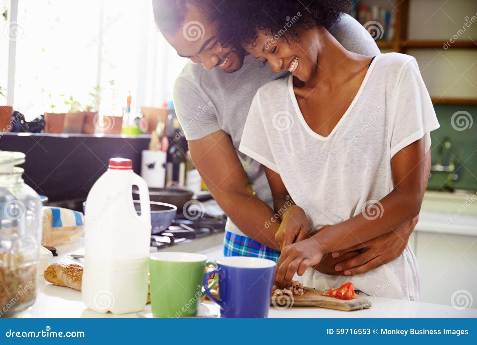 Young Couple Preparing Breakfast in Kitchen Together Stock Image ...