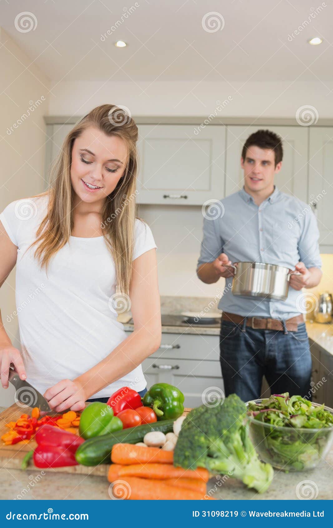 Young Couple Preparing Dinner Stock Image - Image of holding, eating ...