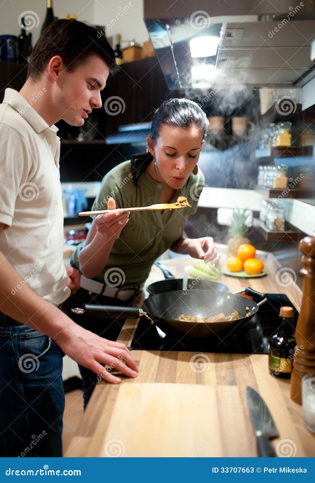 Young Couple Preparing Lunch Stock Image - Image of cooking, indoor ...