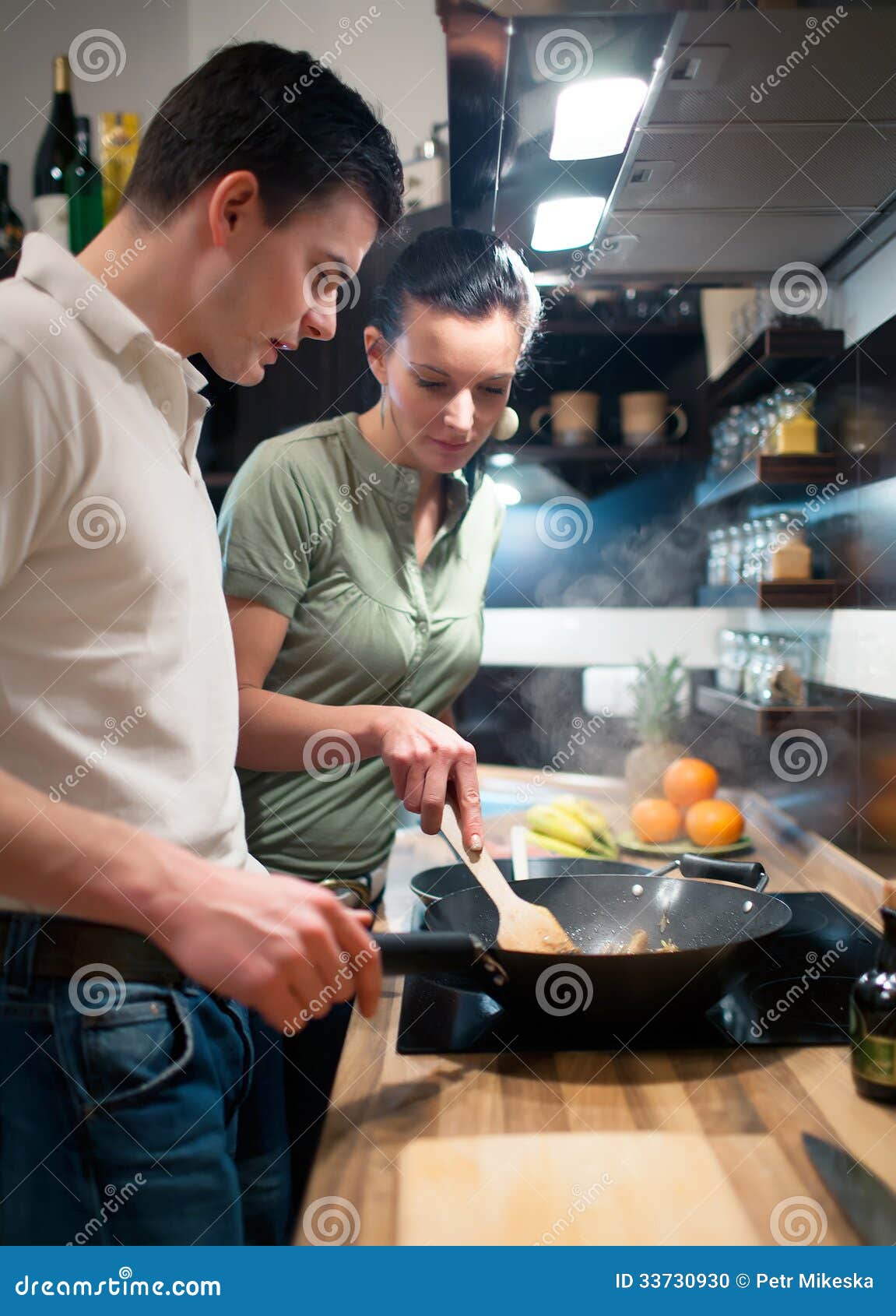 Young Couple Preparing Lunch in Kitchen Stock Photo - Image of happy ...