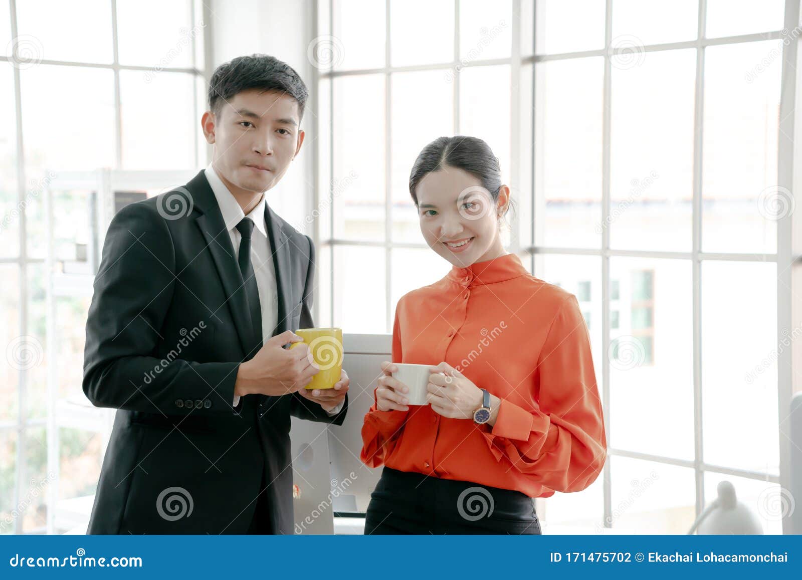 Young Couple of Professionals Chatting during Coffee Break Stock Photo ...