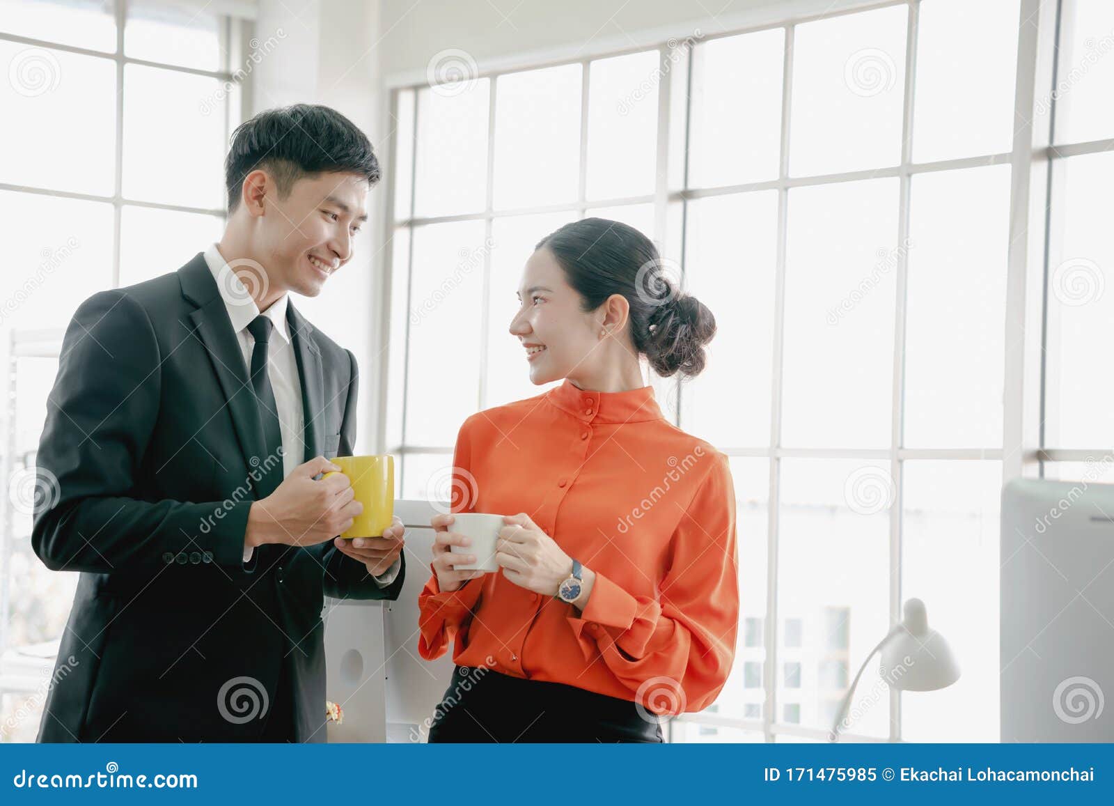 Young Couple of Professionals Chatting during Coffee Break Stock Image ...
