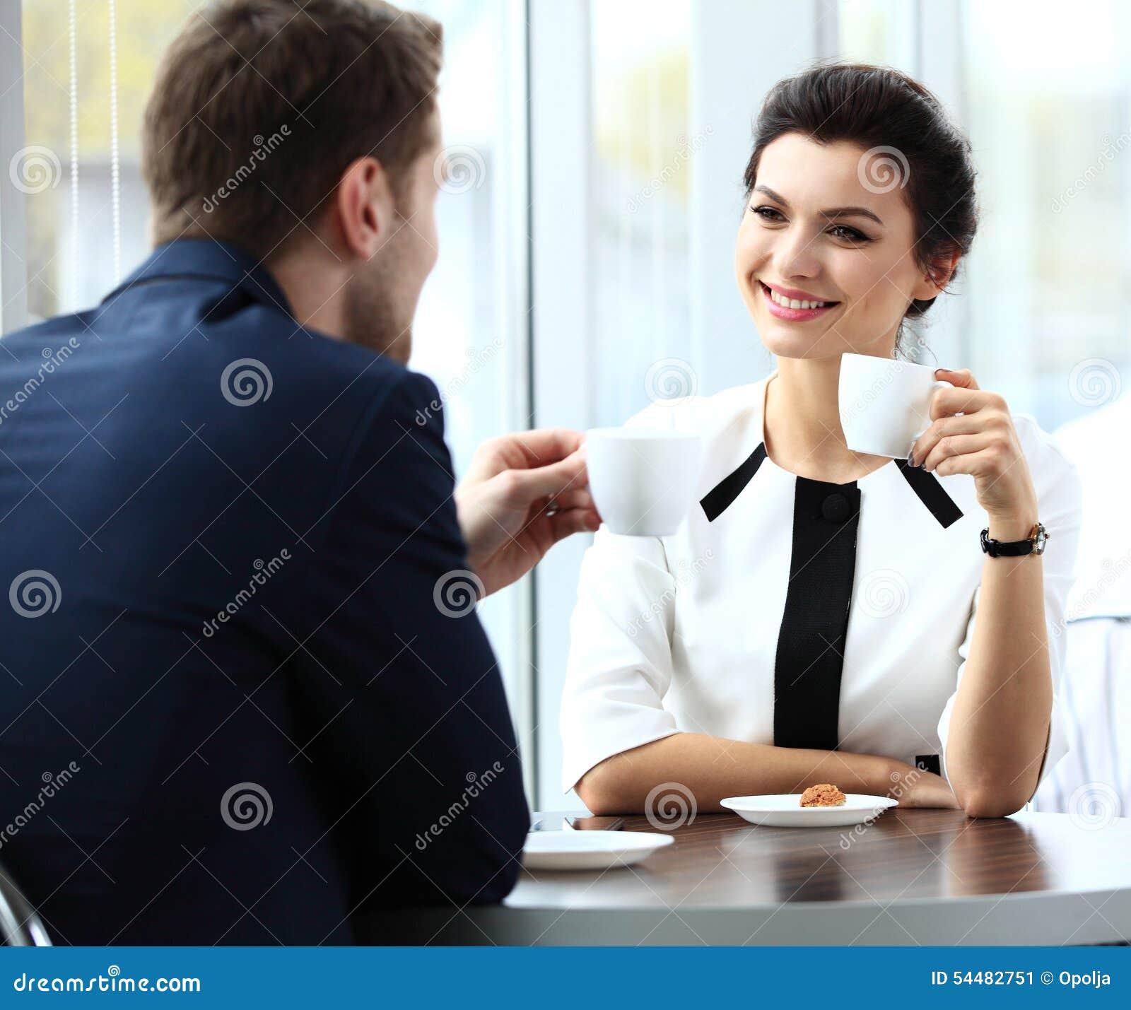 Young Couple of Professionals Chatting during a Coffeebreak Stock Image ...