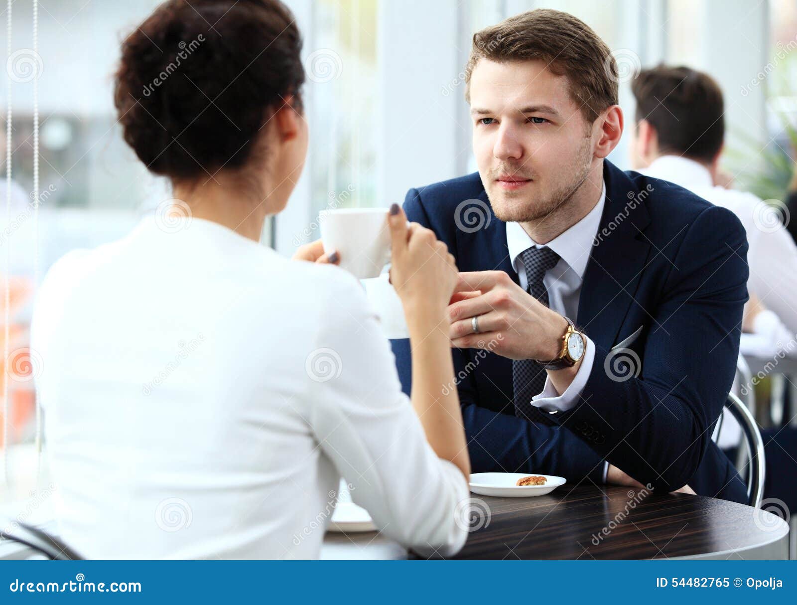 Young Couple of Professionals Chatting during a Coffeebreak Stock Image ...