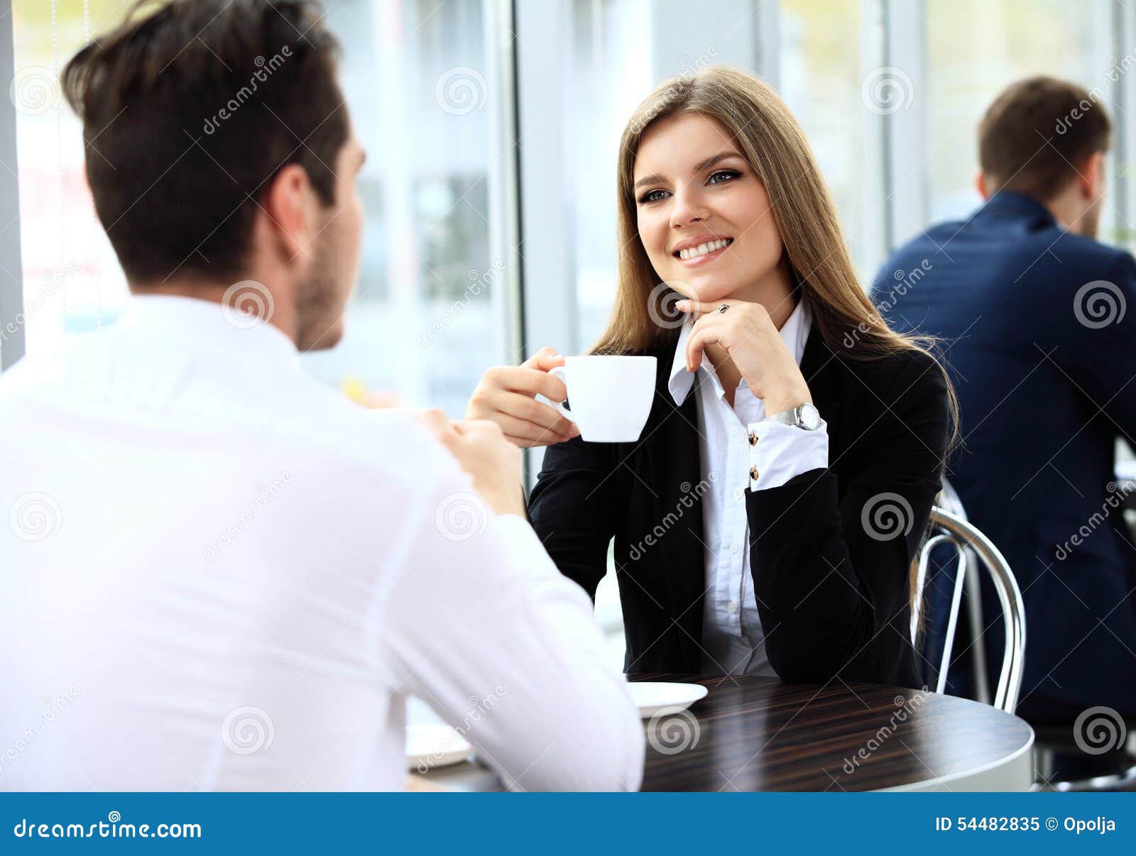 Young Couple of Professionals Chatting during a Coffeebreak Stock Image ...