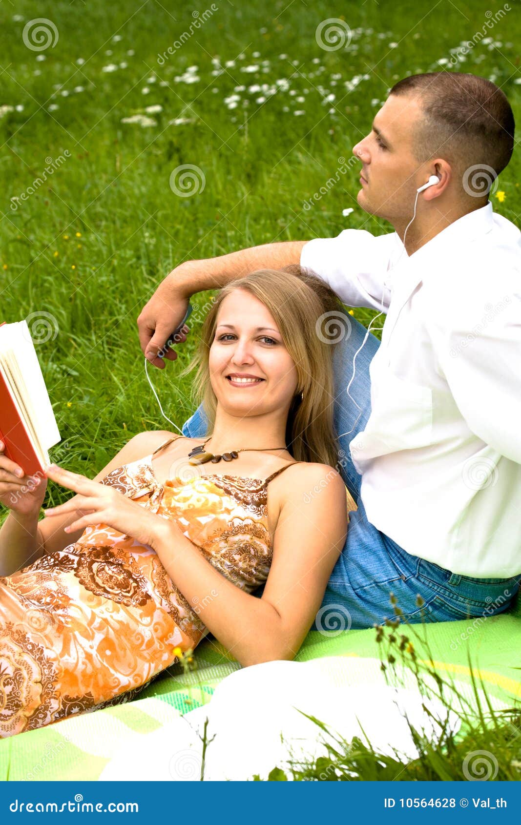 Young couple relaxing stock photo. Image of grass, meadow - 10564628