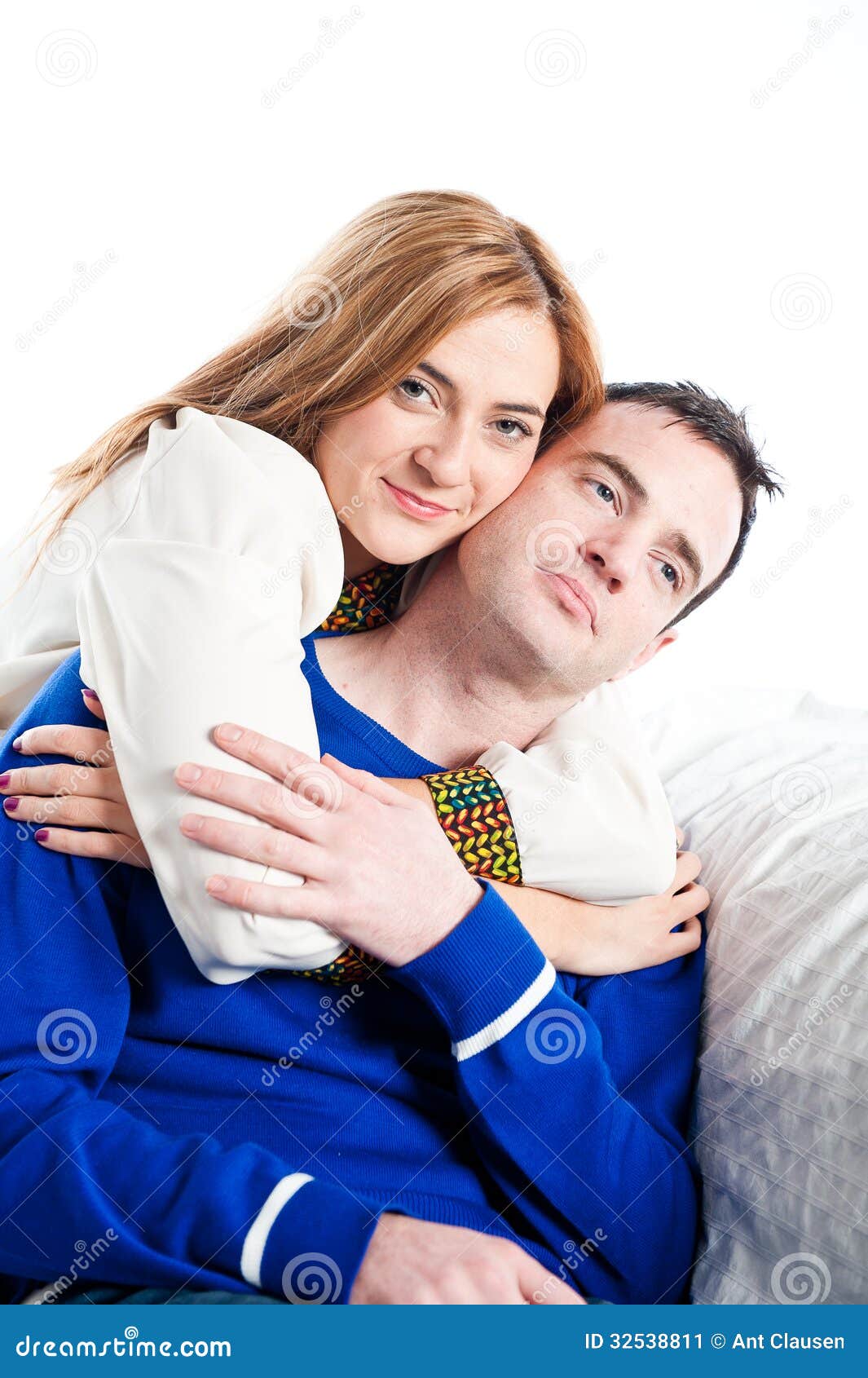Young Couple Relaxing and Cuddling Together on the Sofa Stock Image ...