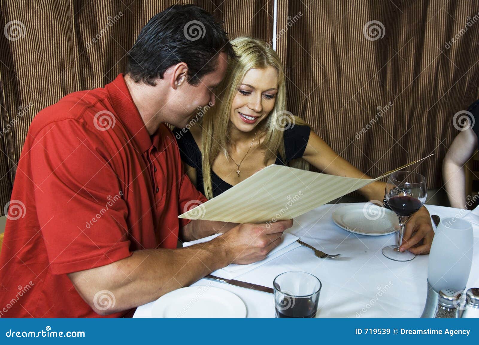 Young Couple in the Restaurant Stock Image - Image of menu, friends: 719539